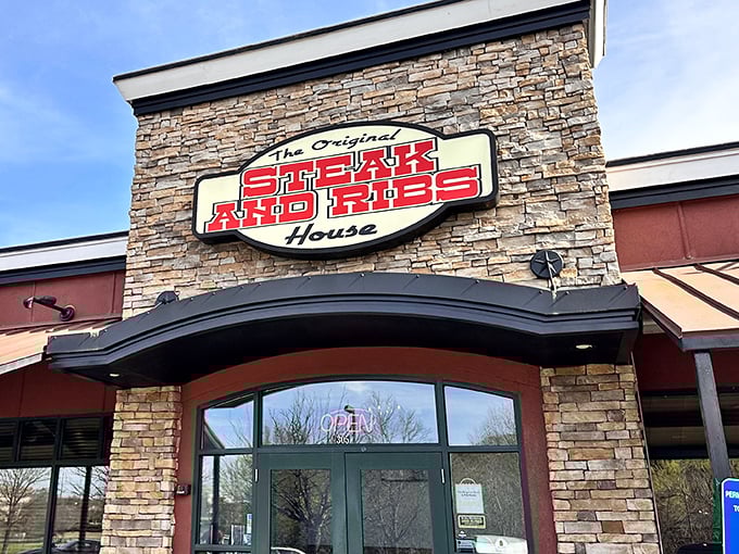 The stone facade with that bold red sign promises exactly what you'll find inside: no-nonsense deliciousness that doesn't need fancy frills to impress.
