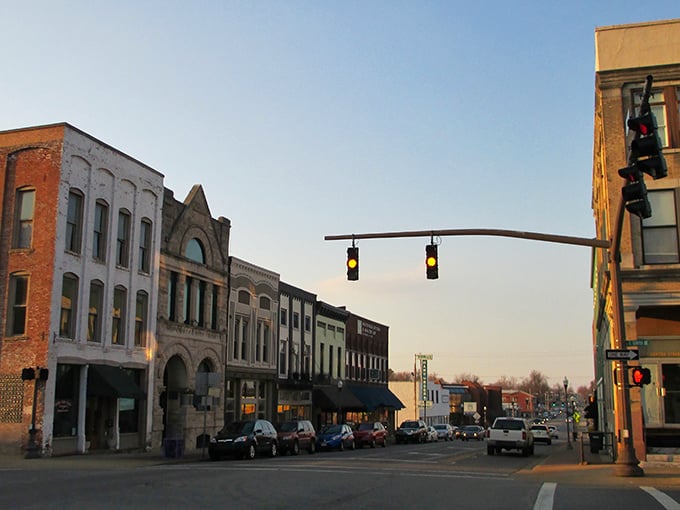 Madisonville's historic downtown glows with golden hour charm, where brick buildings stand as silent witnesses to generations of Kentucky stories. 