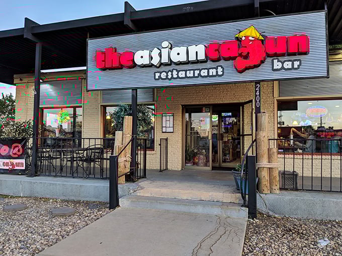 The Asian Cajun’s bold red crab and playful signage hint at the fusion feast inside — a culinary treasure hiding in plain sight.
