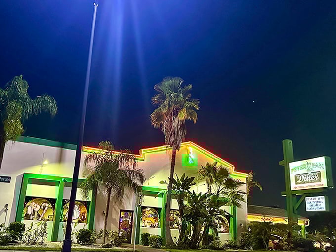 Peter Pan Diner's neon glow transforms the Oakland Park night into a beacon for breakfast lovers. Like a culinary lighthouse guiding hungry souls home.