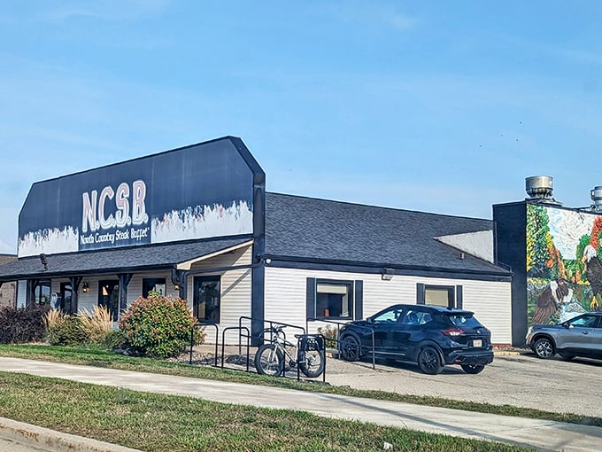 That bold black-and-white sign isn’t just branding—it’s Wisconsin’s version of a desert oasis, only with more gravy and fewer camels.
