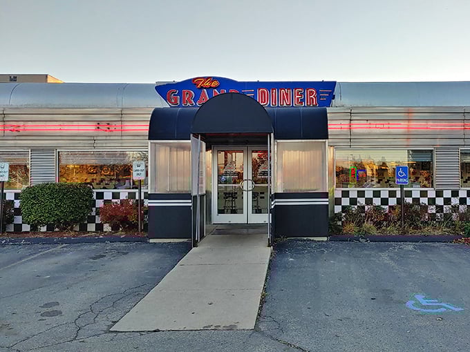 Classic chrome meets comfort food at The Grand Diner, where the American flag waves proudly over breakfast dreams.