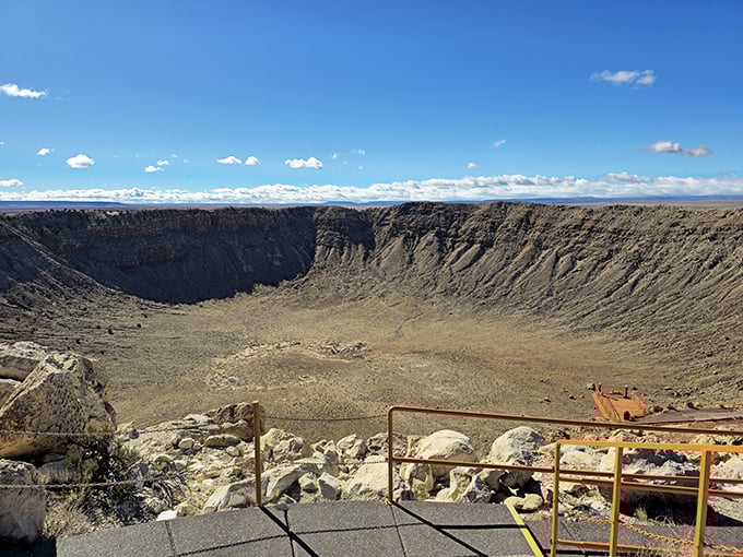 Nature's perfect punch bowl stretches nearly a mile wide, reminding us we're just cosmic dust bunnies in the grand scheme of things.
