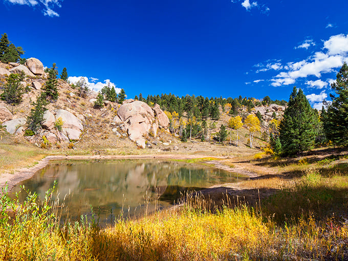 Where earth meets sky in perfect harmony – Mueller's pristine ponds reflect Colorado's impossibly blue heavens and sun-kissed rock formations.