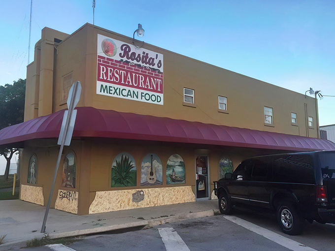 The yellow building with burgundy awning isn't trying to impress anyone—until you taste what's inside. Florida's best-kept enchilada secret hides in plain sight.