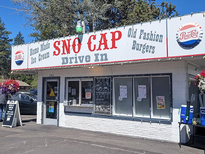 The classic white building with bold red "SNO CAP" lettering isn't trying to impress anyone—except your taste buds, which will be thoroughly wowed.