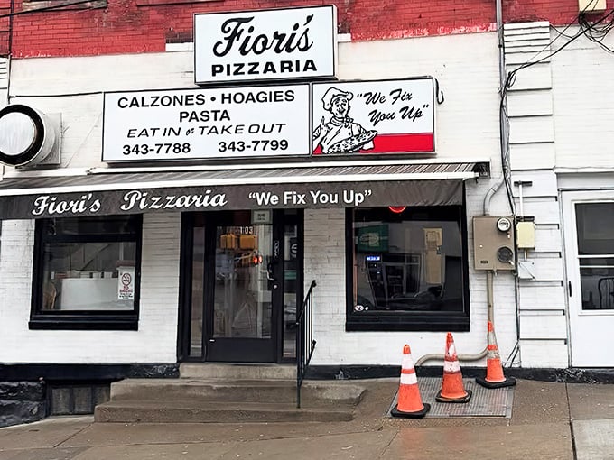 The unassuming storefront that launches a thousand pizza pilgrimages. "We Fix You Up" isn't just a slogan—it's a solemn promise to your taste buds. 