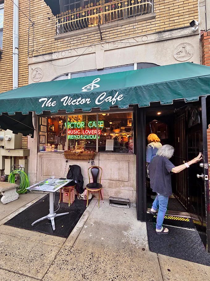 The iconic green awning of Victor Café beckons like an old friend, promising both culinary delights and musical surprises behind those doors.