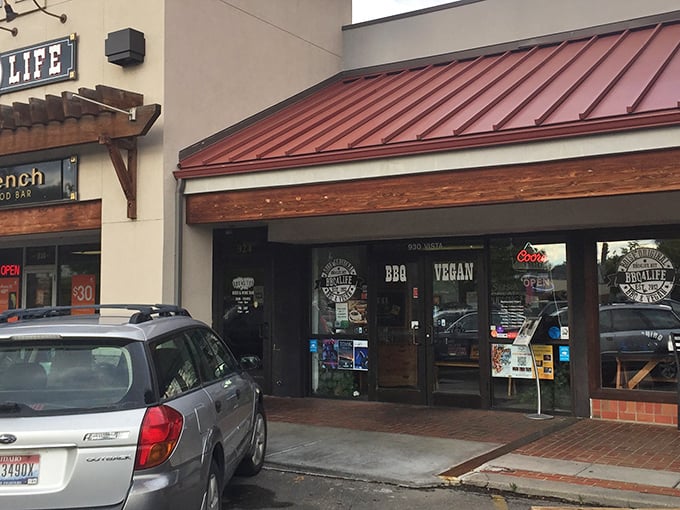 A second view of BBQ4LIFE's storefront, where the "BBQ" and "VEGAN" signs peacefully coexist like an unlikely buddy comedy.