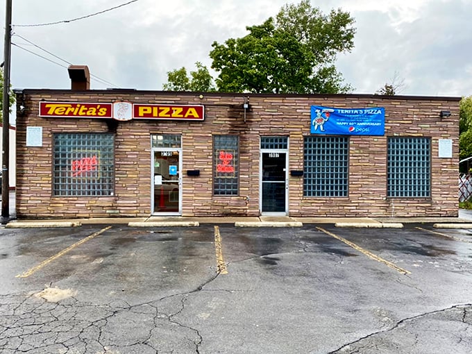The unassuming stone facade of Terita's Pizza stands as a monument to the adage that books—and pizzerias—should never be judged by their covers.