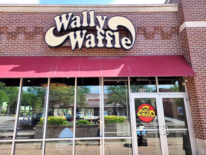 The iconic Wally Waffle storefront in Akron beckons with its retro sign and welcoming red awning—like a breakfast beacon calling you home.