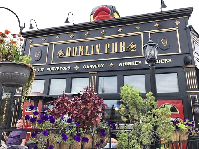 The Dublin Pub's striking black and gold façade stands as a beacon of Irish hospitality in Dayton's Oregon District, promising authentic flavors and good times within.