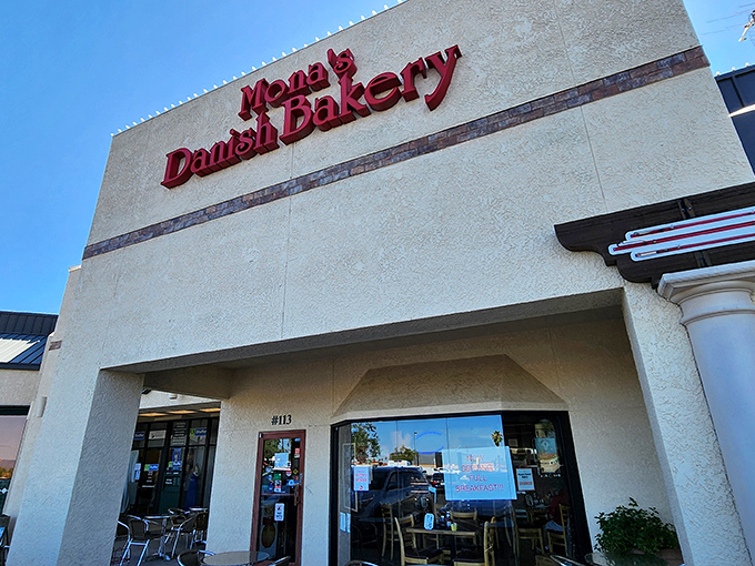 The bold red lettering against the cream-colored exterior isn't just signage—it's a beacon of hope for carb enthusiasts seeking Danish delights in the Arizona desert.