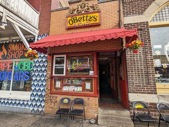 A red awning and vintage signage announce O'Betty's presence like a culinary landmark. No pretension here, just hot dog perfection waiting inside.