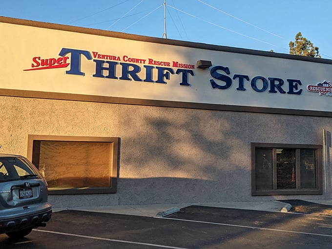 The unassuming beige exterior hides a treasure trove within—like finding the secret entrance to Narnia, but with vintage clothing instead of talking lions.