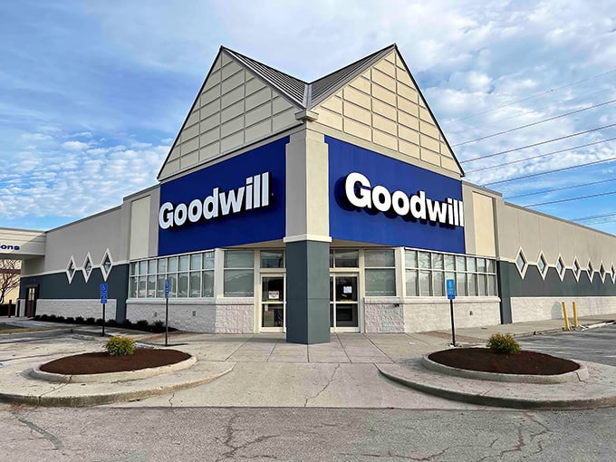 The blue and white façade of Goodwill on Laskin Road stands like a beacon for bargain hunters—architectural proof that treasure doesn't always hide in fancy packages.