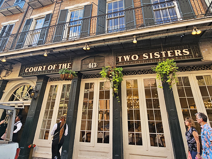On Royal Street, the Court of Two Sisters welcomes you with its green façade and the irresistible promise of true New Orleans flavor.