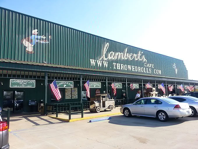 The green exterior of Lambert's proudly announces itself as the "Home of Throwed Rolls," a promise of both carbs and entertainment awaiting inside.