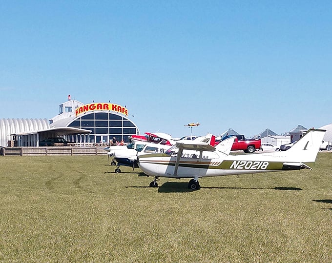 Where farm fields meet flight paths! The Hangar Kafe in Miller stands proudly against the Missouri sky, with actual small aircraft parked outside—talk about curbside service.