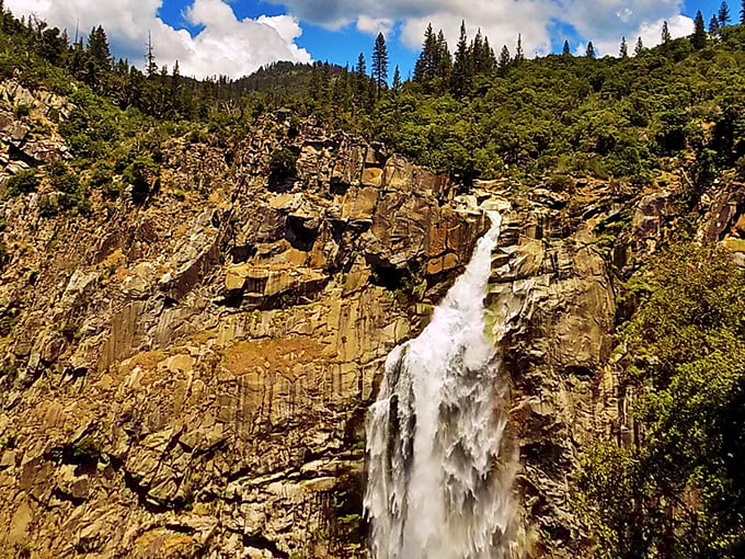 Nature's grand performance: Feather Falls cascades 410 feet down ancient granite cliffs, putting on a show that rivals any Broadway production.