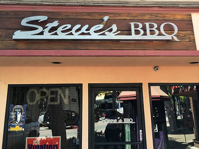 The wooden sign says it all – Steve's BBQ welcomes hungry visitors with rustic charm and the promise of smoky delights within.