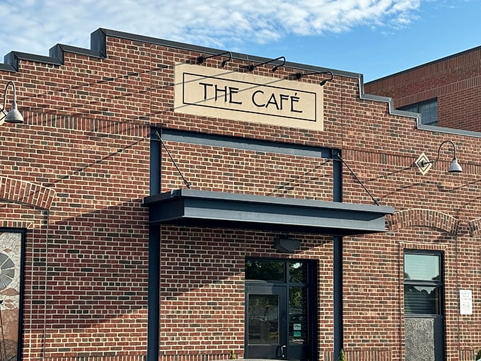 The unassuming brick exterior of The Café speaks volumes – greatness doesn't need neon signs or flashy gimmicks, just consistently excellent food.
