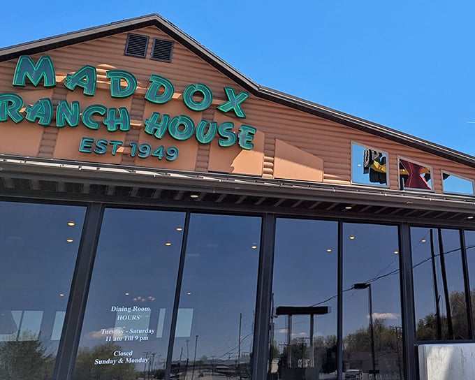 The iconic green lettering of Maddox Ranch House glows against the rustic exterior, a beacon of comfort food that's been drawing hungry Utahns for generations.