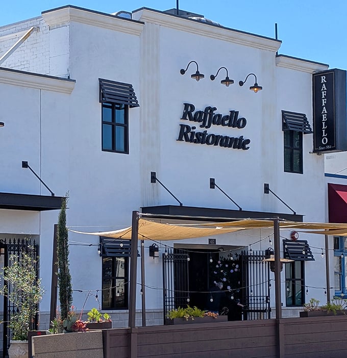 The crisp white facade of Raffaello Ristorante stands like a culinary lighthouse in San Pedro, beckoning hungry souls with promises of pasta perfection.