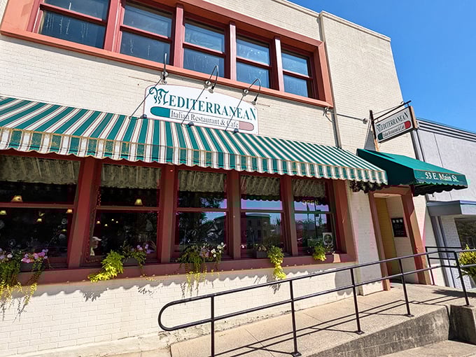 The classic green and white awning of Mediterranean Restaurant beckons like an old friend, promising authentic Italian flavors in downtown Wilmington.