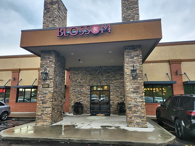 The stone pillars flanking Blossom Buffet's entrance aren't just architectural flair—they're sentinels guarding a treasure trove of culinary delights inside.
