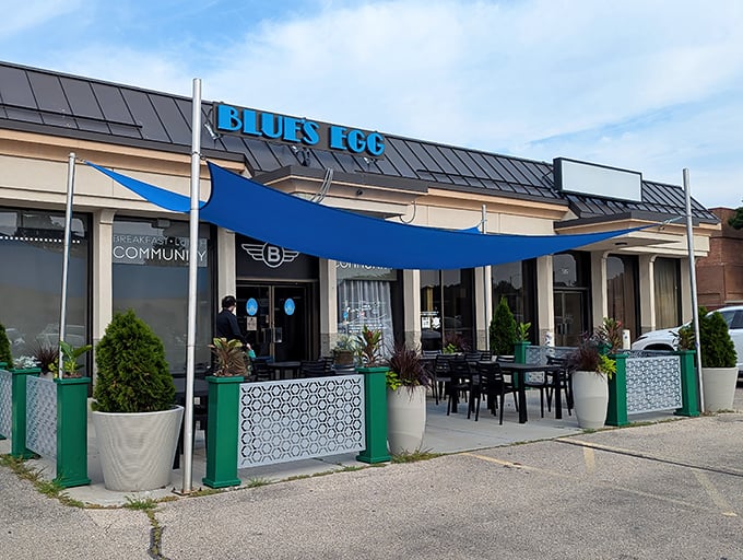 Blue's Egg announces itself with a splash of azure against Milwaukee's skyline, like a sapphire promising breakfast treasures within.