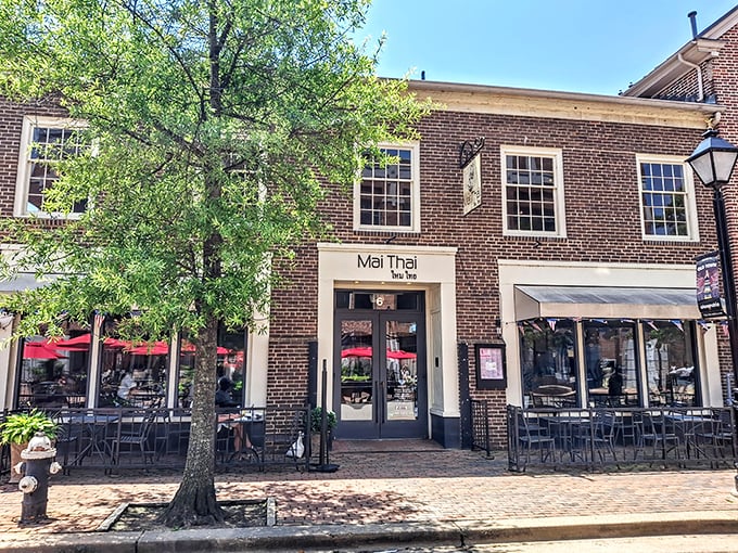 Historic charm meets culinary excellence at Mai Thai's brick façade in Old Town Alexandria. Those red awnings practically whisper, "Come in, the noodles are calling."
