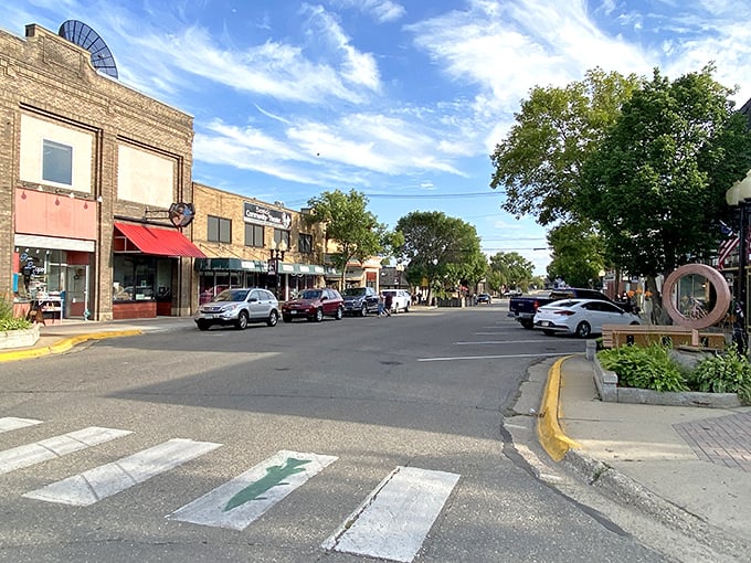 Downtown Bemidji's charming main street feels like stepping into a Norman Rockwell painting, complete with fish-adorned crosswalks that remind you exactly where you are.