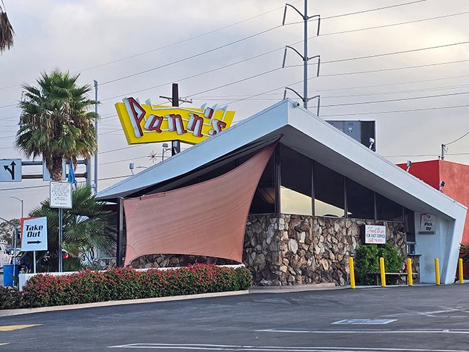 That dramatic roofline isn't just for show—it's architectural jazz, a visual symphony from an era when America's optimism reached for the stars.