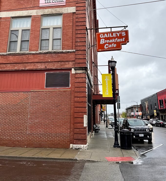 That iconic orange sign hanging from the historic brick building isn't just a marker—it's a breakfast bat-signal for hungry Springfield locals.