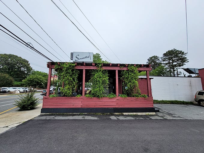 That striking red pergola isn't just architectural flair—it's your beacon to breakfast paradise in downtown Greensboro.