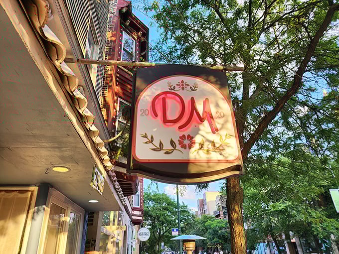 That charming blue-trimmed storefront isn't just easy on the eyes—it's your gateway to French bistro heaven in Lincoln Square.