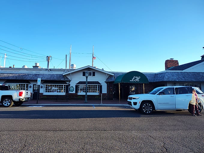 The classic white exterior of The Lobster House stands like a maritime beacon, promising seafood treasures within. Cape May's legendary restaurant has been luring hungry travelers for generations.