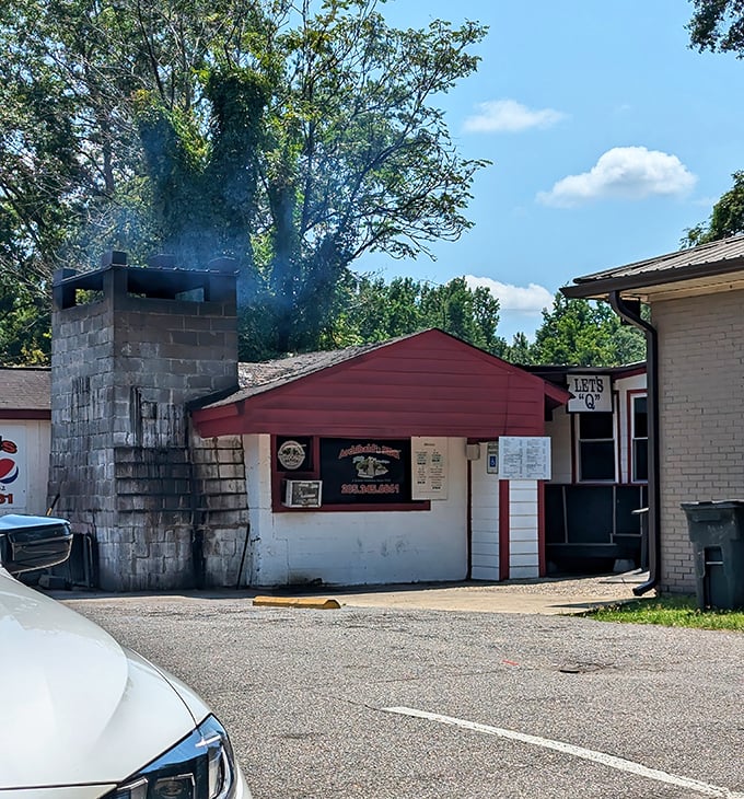 That cinder block chimney isn't just for show—it's been pumping out aromatic smoke signals for decades.