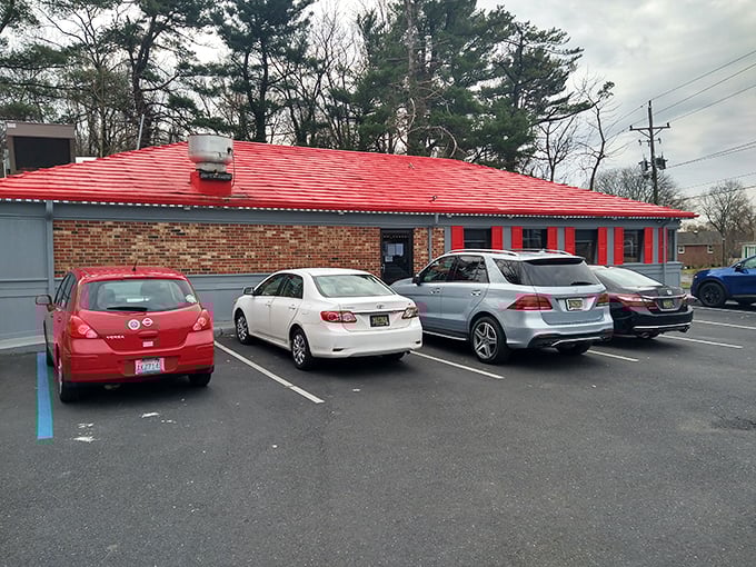 A second view of the diner's exterior reveals its distinctive red roof – like a beacon calling hungry travelers home after a long journey.