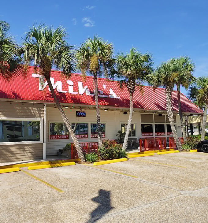 That classic red roof against the Florida sky is like a beacon for seafood lovers—palm trees standing guard over what locals know is culinary treasure.