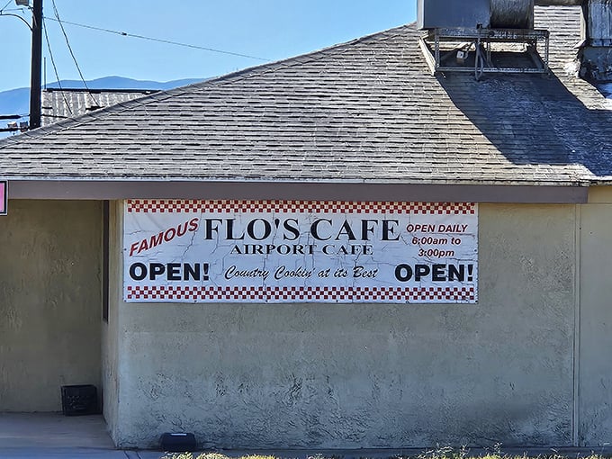 The unassuming exterior of Flo's Airport Cafe promises what fancy restaurants can't – honest food with zero pretension and 100% satisfaction guaranteed.