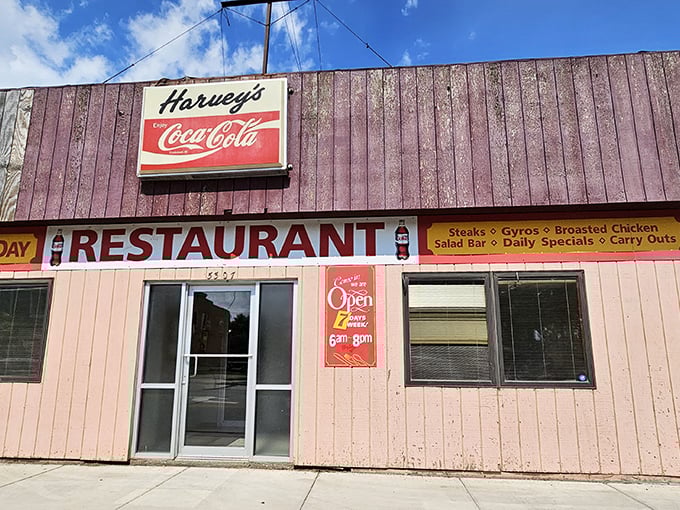 That vintage Coca-Cola sign isn't just decoration—it's a time machine that transports you to an era when restaurants didn't need fancy facades to serve extraordinary food.