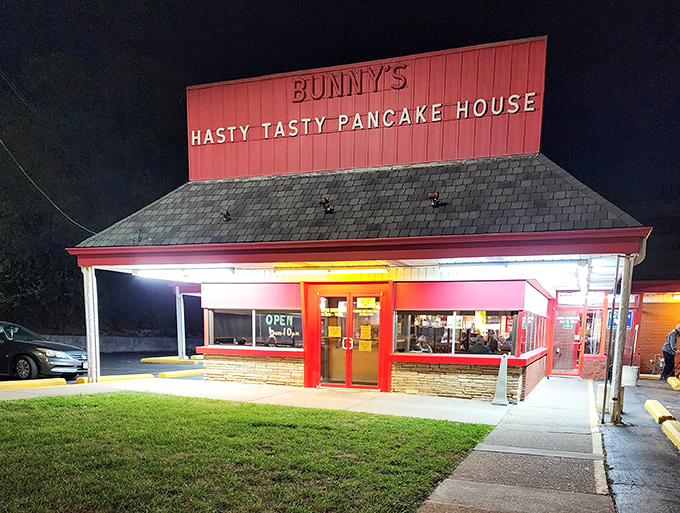 The iconic red exterior of Bunny's Hasty Tasty Pancake House glows like a beacon for breakfast lovers. No fancy frills, just the promise of honest-to-goodness comfort food.