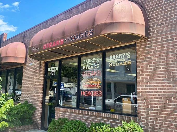 The unassuming brick façade of Barry's hides Philadelphia's best-kept cheesesteak secret. That burgundy awning might as well be a superhero cape.