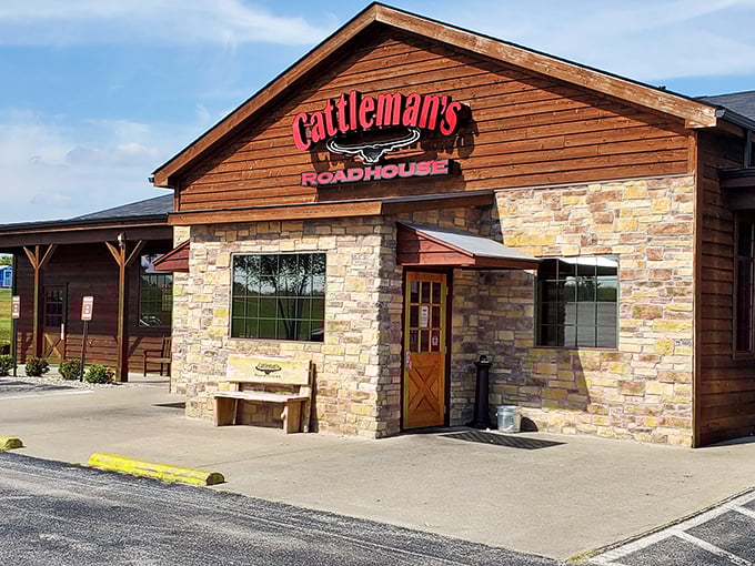 The rustic wood and stone exterior of Cattleman's Roadhouse promises what every carnivore dreams of—a serious commitment to steak perfection.