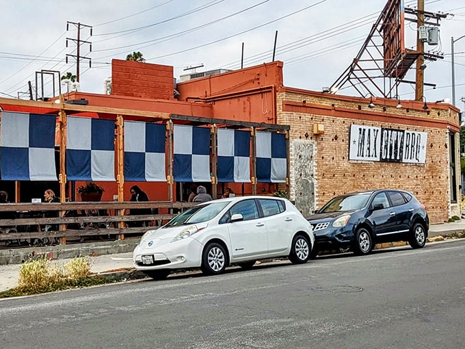 Those blue and white checkered panels aren't just decorative—they're a signal flag for serious barbecue enthusiasts passing by.