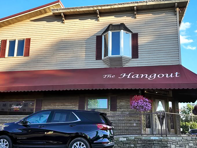 The Hangout's welcoming exterior with its signature red awning stands as a beacon of comfort food in downtown Danville, where hungry travelers and locals alike find culinary salvation.