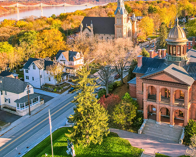 Stillwater's downtown riverfront unfolds like a miniature San Francisco without the hills—brick buildings, green spaces, and that magnificent lift bridge creating postcard perfection.