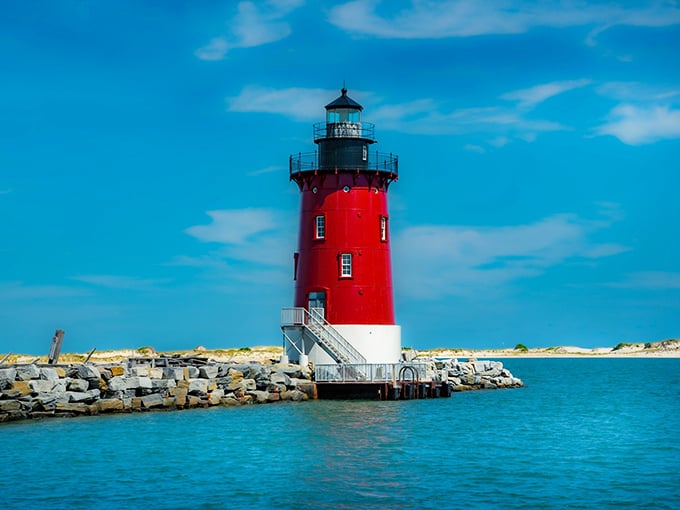 Standing proud like a crimson sentinel against the azure Delaware Bay, this lighthouse doesn't just guide ships—it beckons adventurous souls from miles around.
